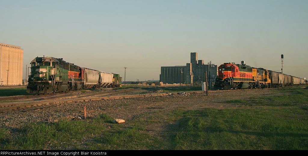Lots of action at the Saginaw interlocking as BNSF 3122 moves on the transfer track between the ...